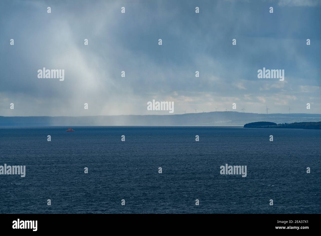 Heavy Rain in the Distance over Big Lake Vattern with Ferry crossing ...