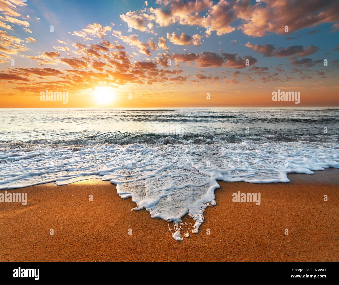Landscape with sea sunset on beach Stock Photo - Alamy