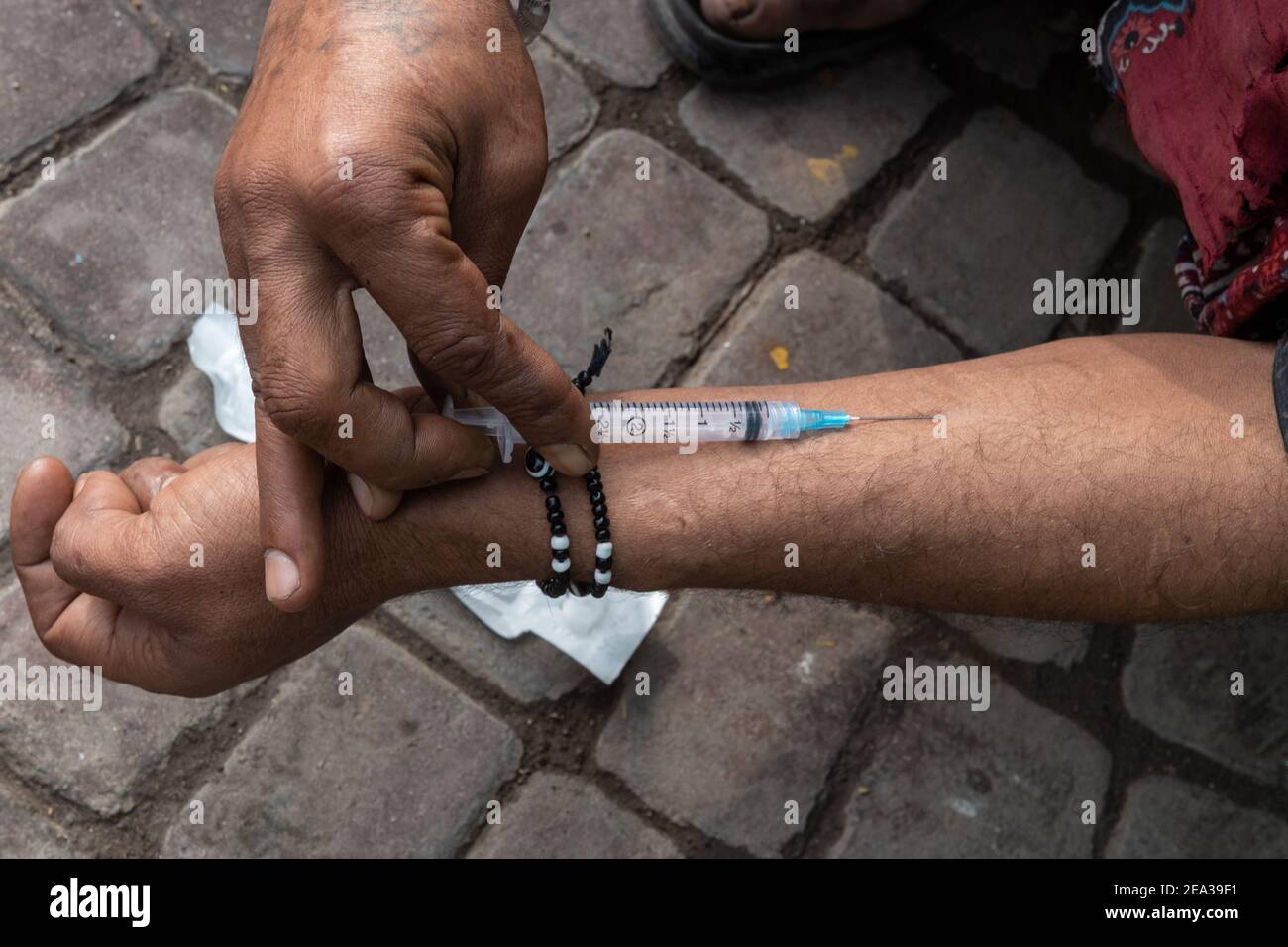 Drug users injecting drugs near Ali Park, Lahore, Punjab, Pakistan ...