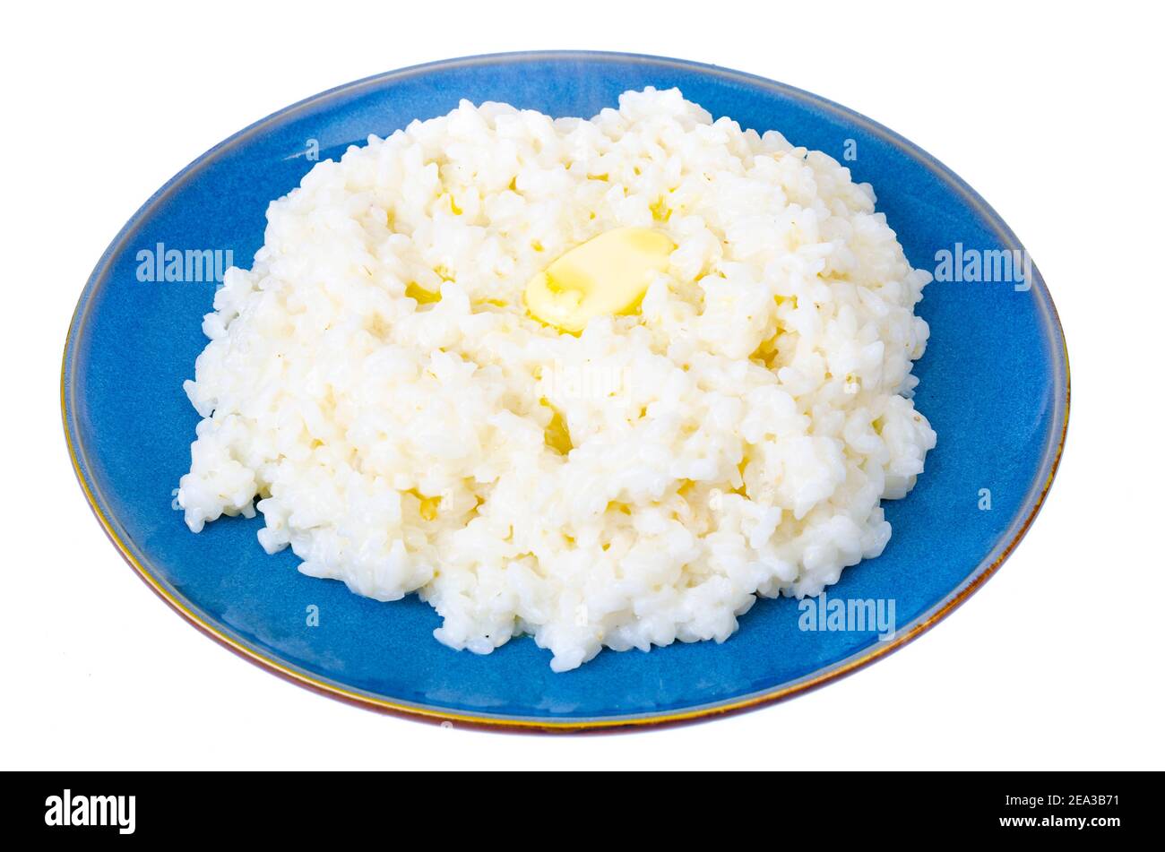 Delicious rice milk porridge in blue plate on white background. Studio ...