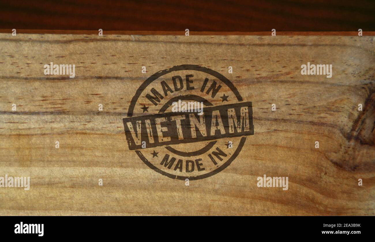 Made in Vietnam stamp printed on wooden box. Factory, manufacturing and ...