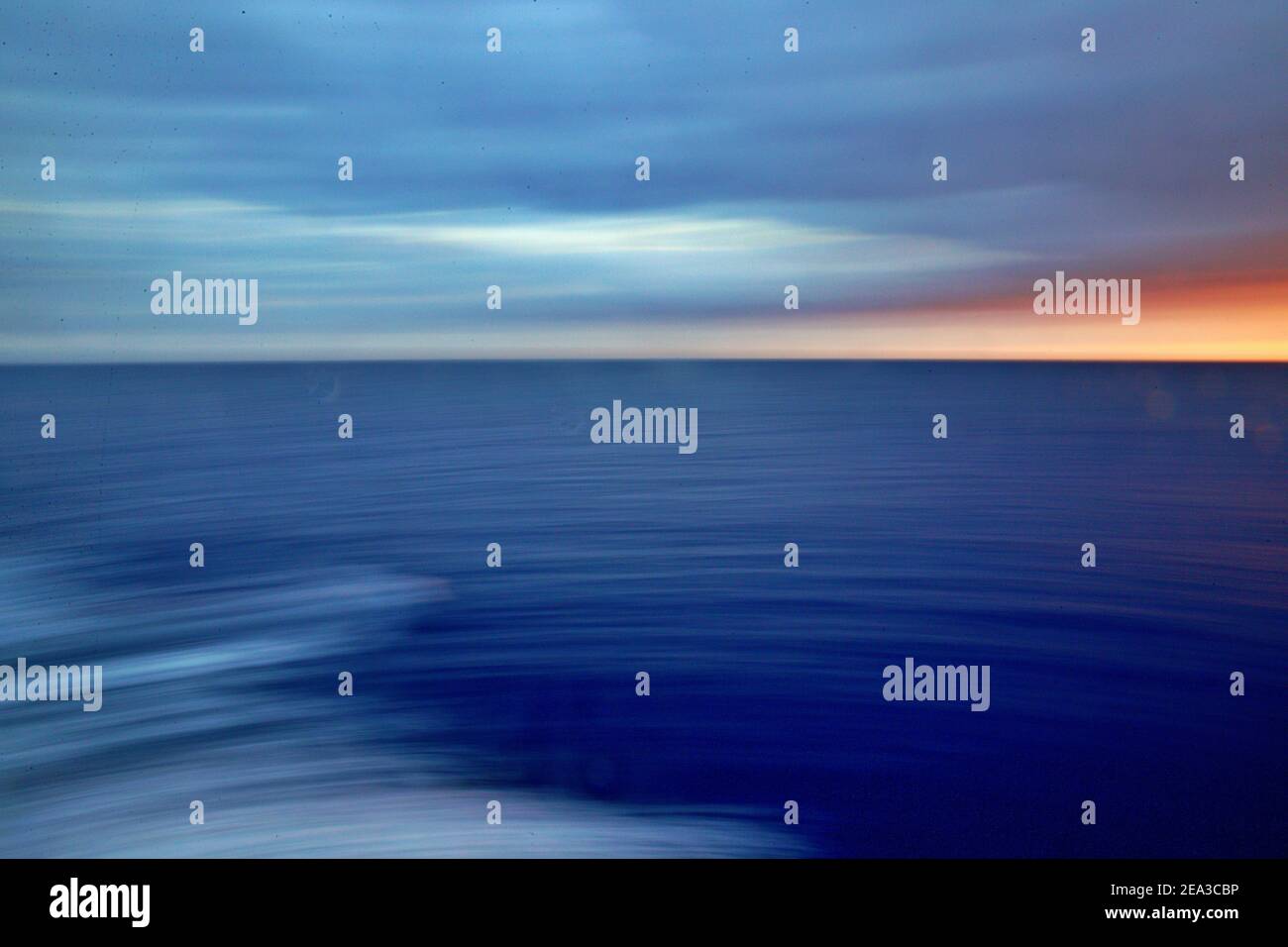 Sun rise over the ocean Stock Photo - Alamy