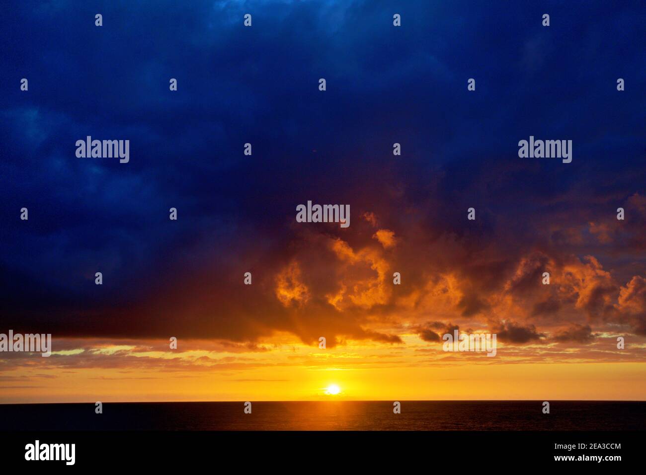 Sun rise over the ocean Stock Photo - Alamy