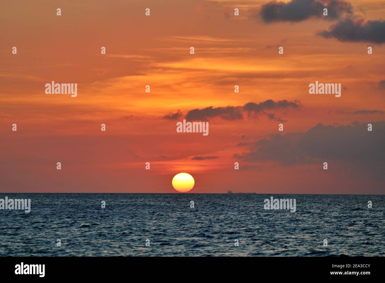 Sun rise over the ocean Stock Photo - Alamy
