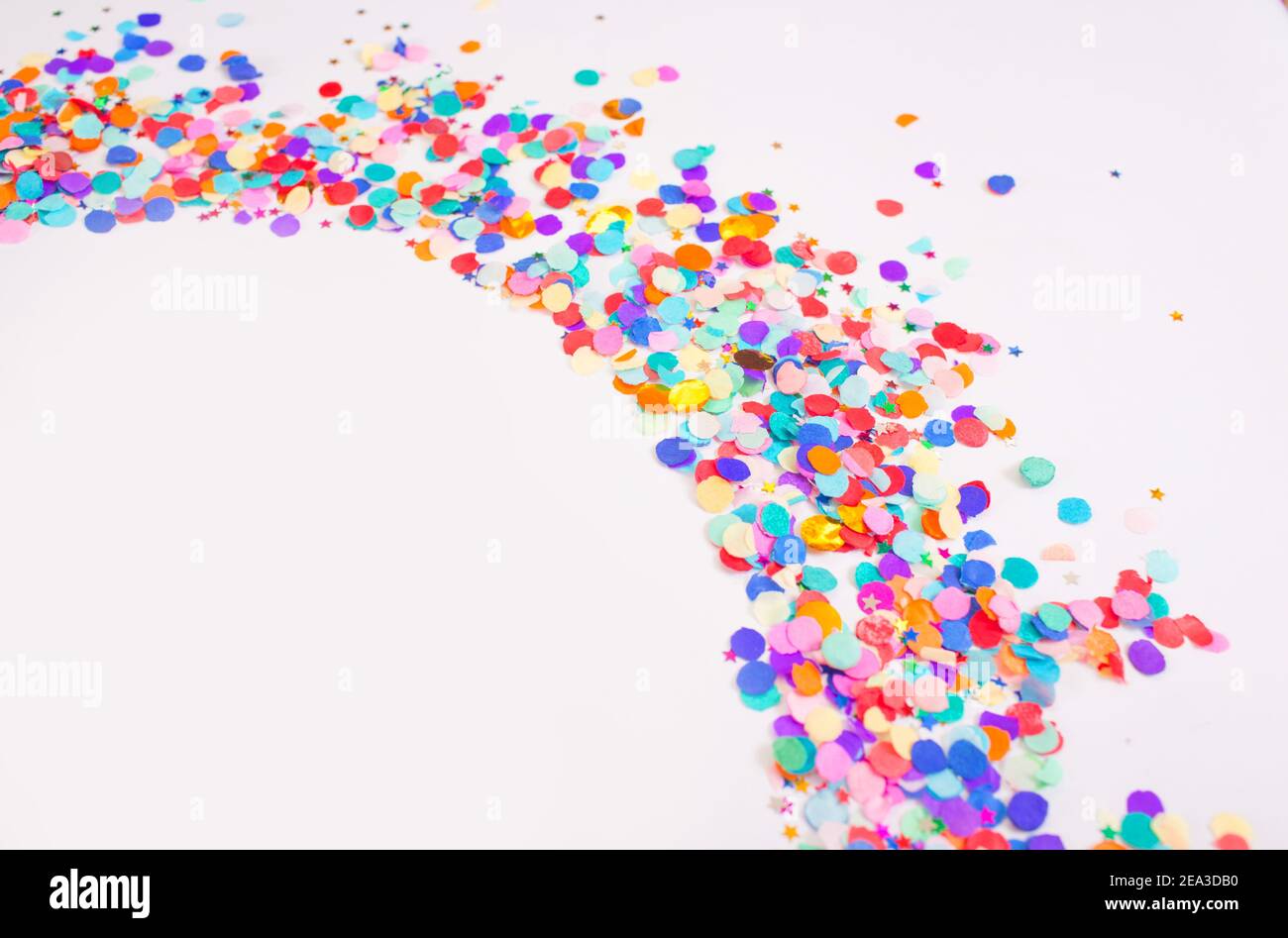 colorful confetti on a white background. Top view Stock Photo - Alamy