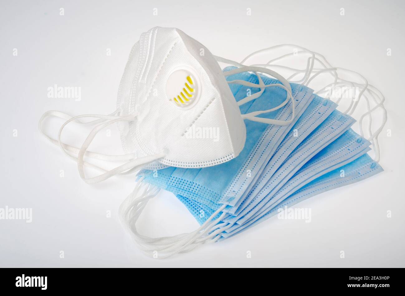 Blue medical disposable masks and white respirators - protection ...