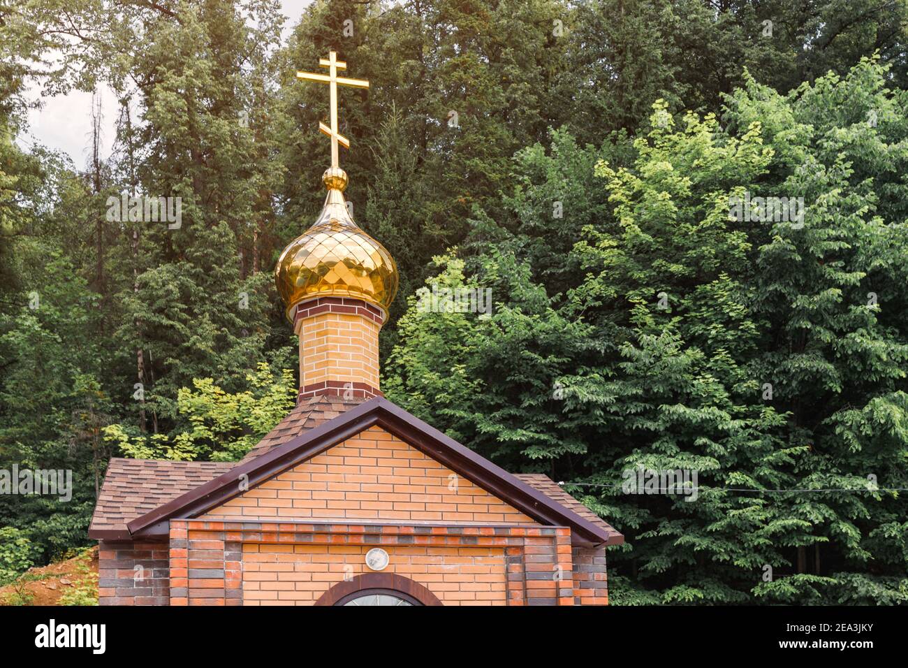 small Orthodox brick chapel in the Park area Stock Photo - Alamy
