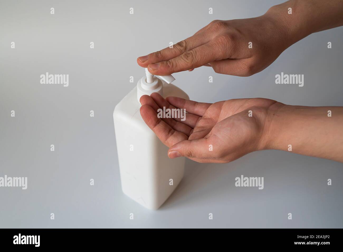 Woman is washing her hands with alcohol-based gel. Hand sanitizer ...