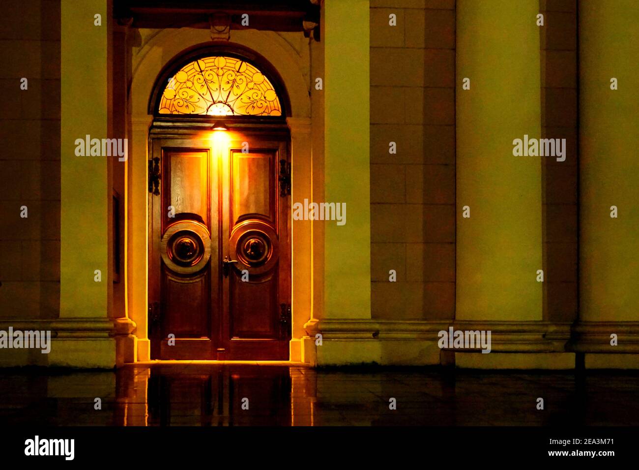 Illuminated door with wall Stock Photo - Alamy