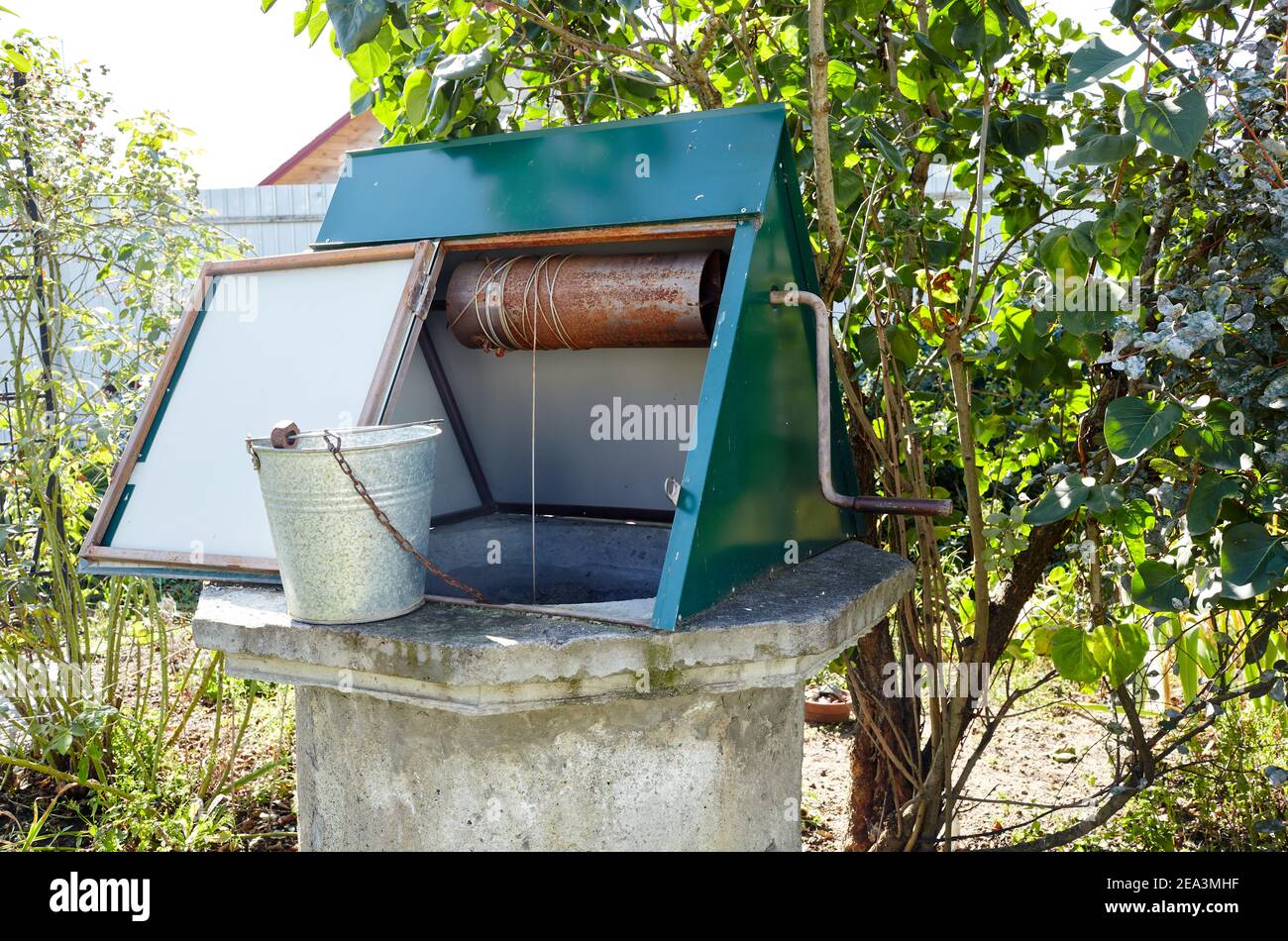 Old draw-well in European village. Retro stone water well in rural area ...