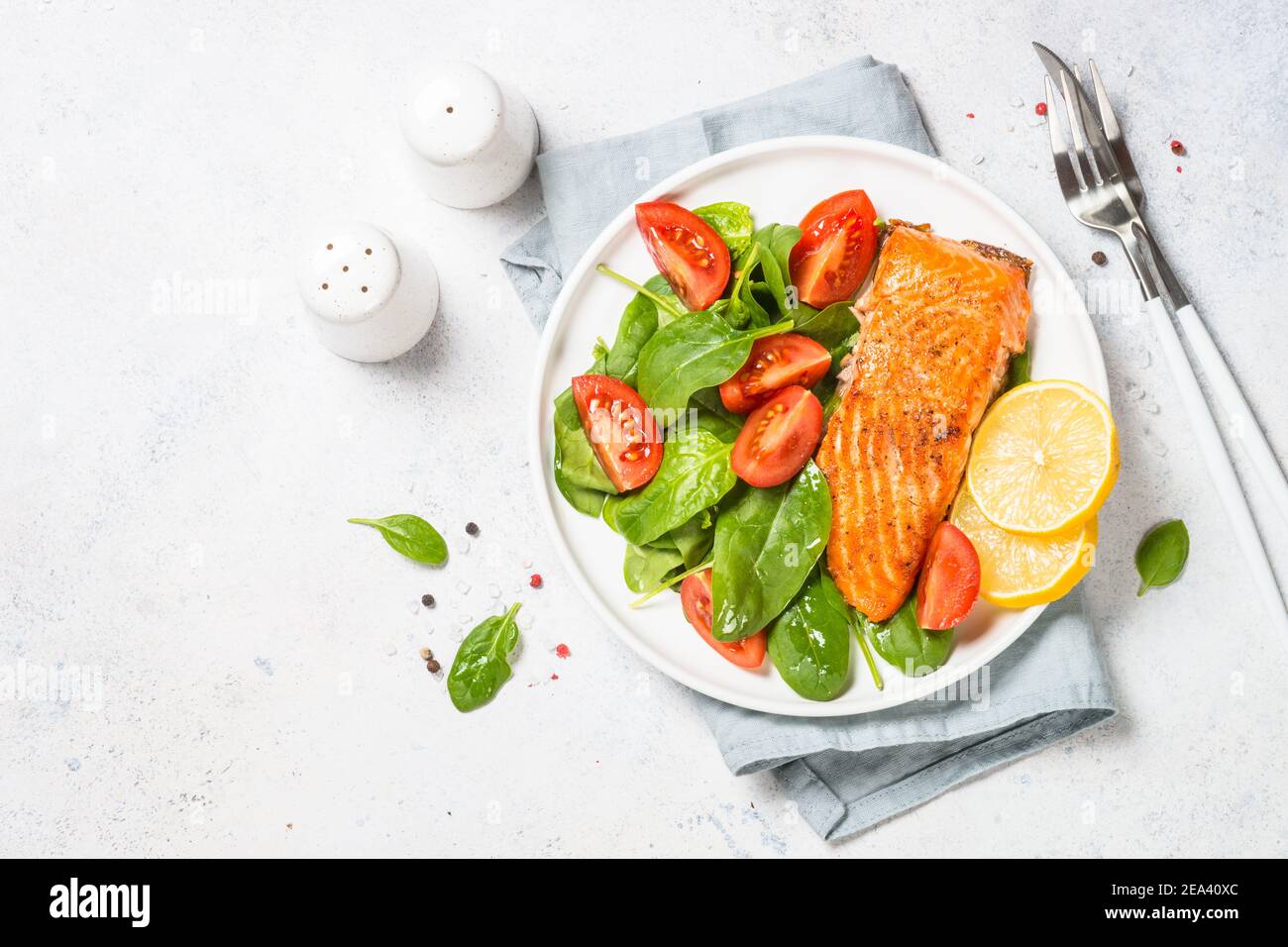 Salmon fillet with fresh salad. at white Stock Photo - Alamy