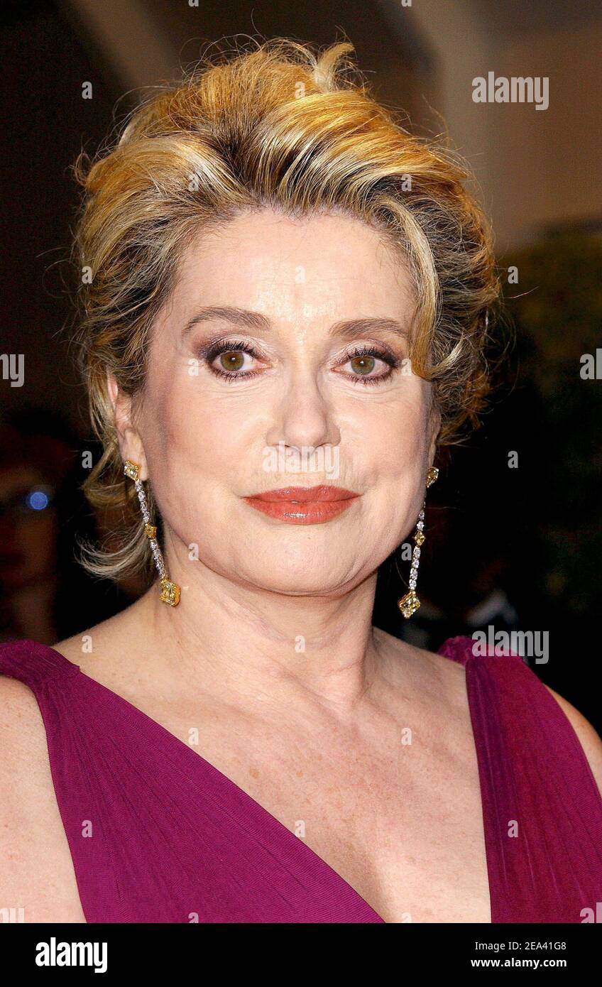 French actress Catherine Deneuve (wearing Chopard earrings) arrives at ...