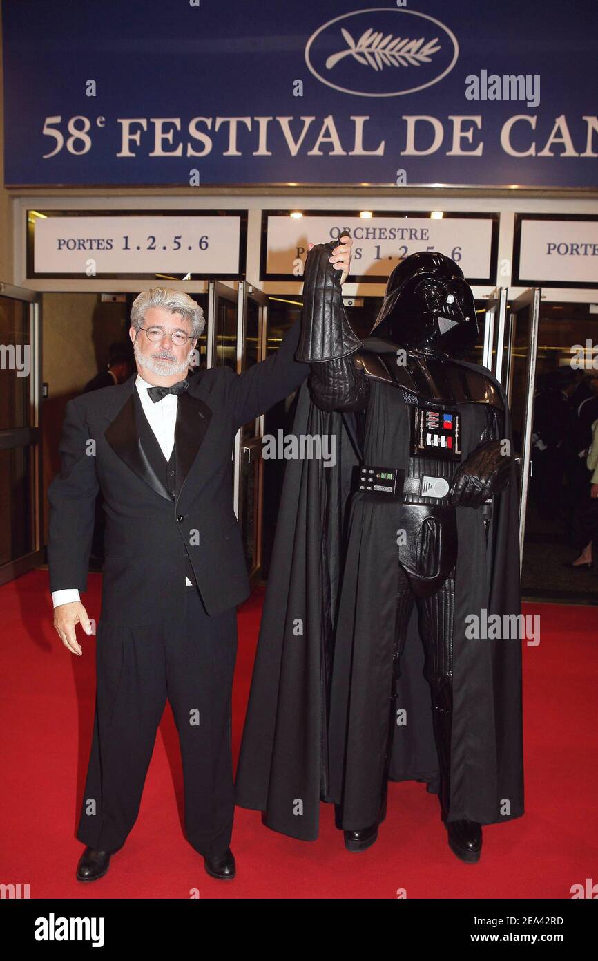 Director George Lucas waves to the crowd with character Darth Vader at ...