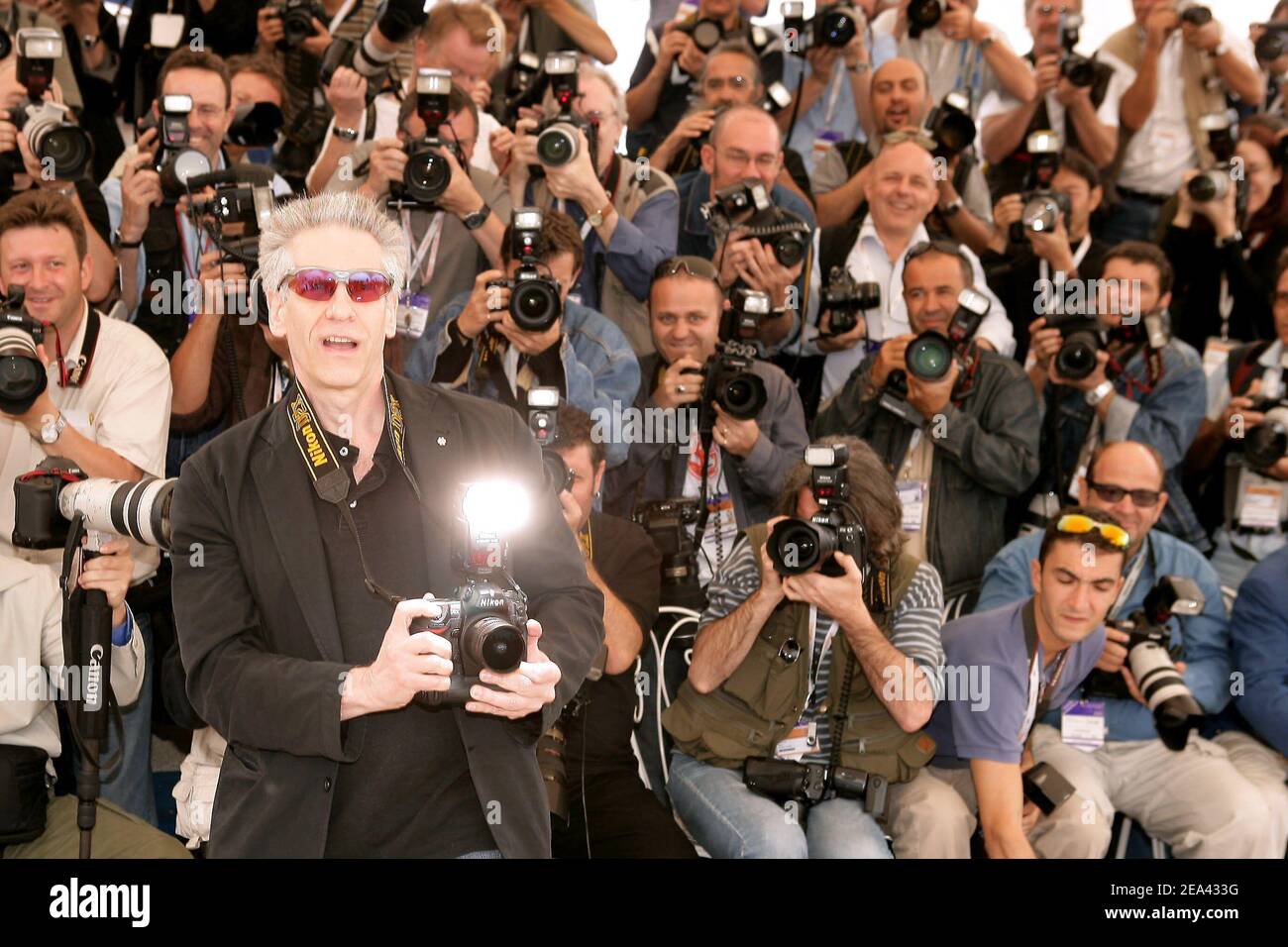 Canadian director David Cronenberg takes photos of photographers during ...