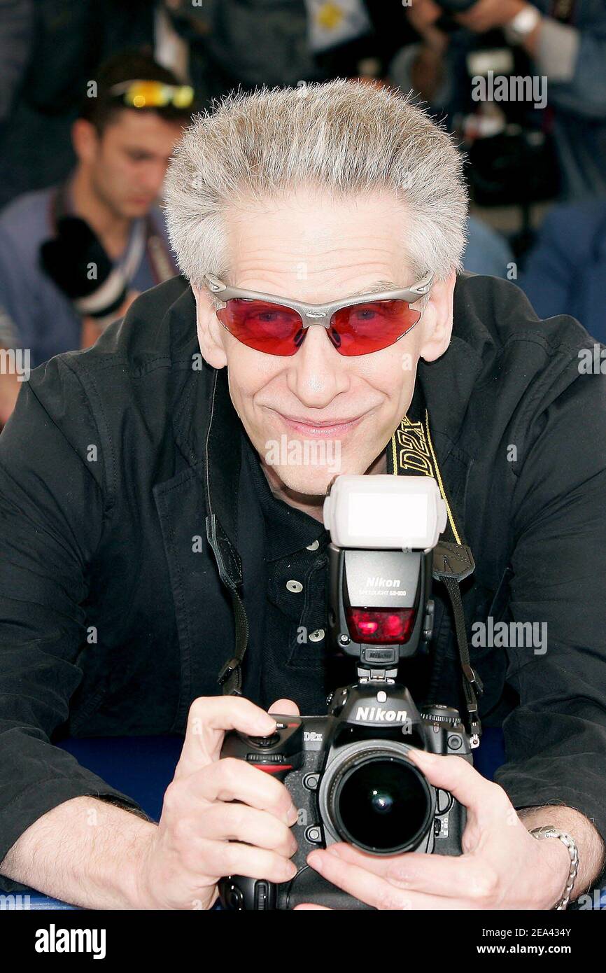 Canadian director David Cronenberg takes photos of photographers during ...
