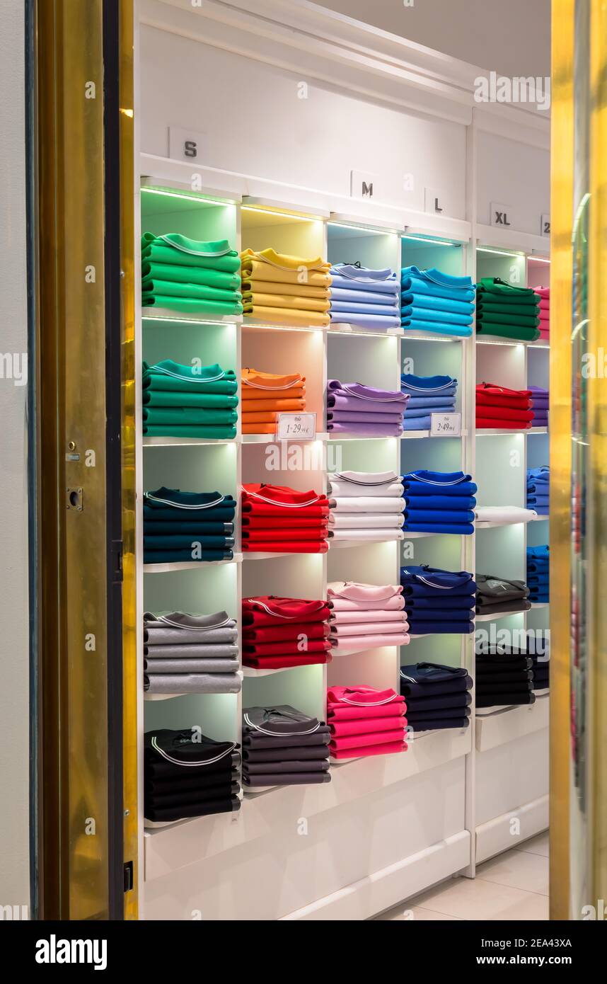 Polo shirt shop interior - fashion store Stock Photo - Alamy