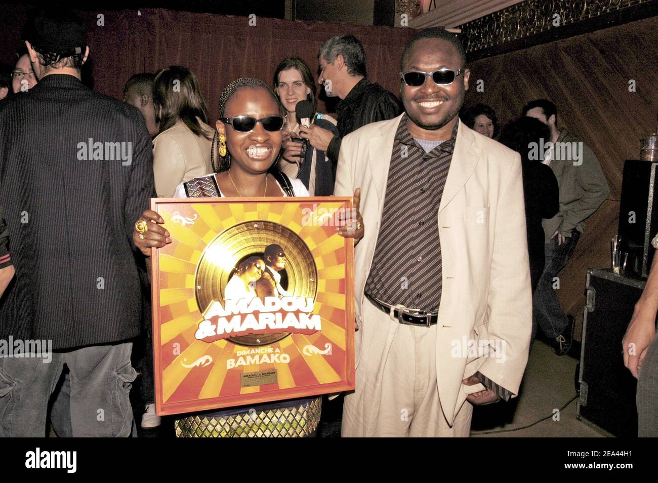 "Blind Malian singers Amadou and Mariam receive a gold record at ""La ...