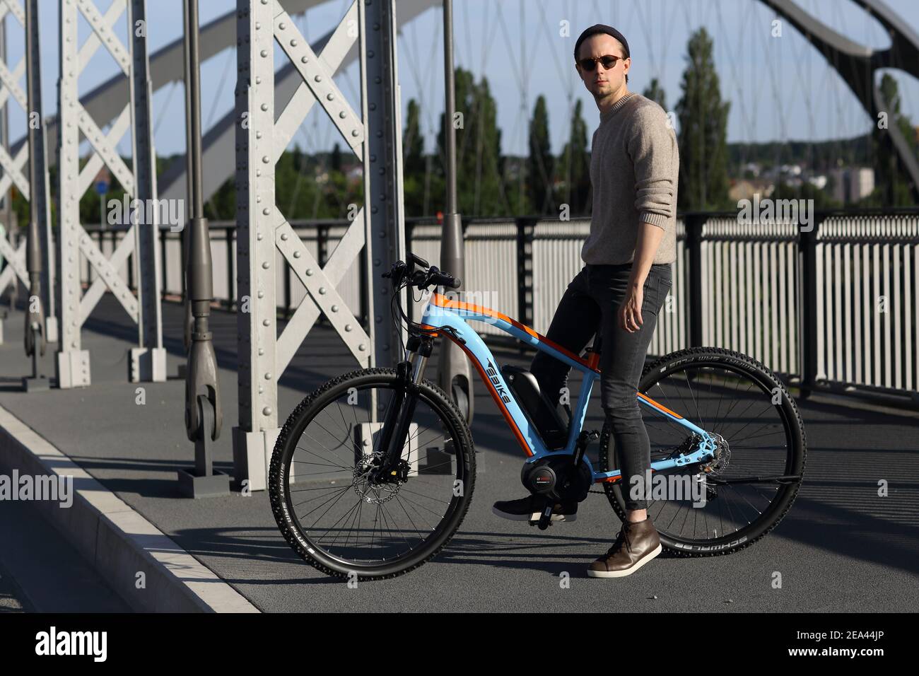 Handsome young man electric bicycle hi-res stock photography and images ...