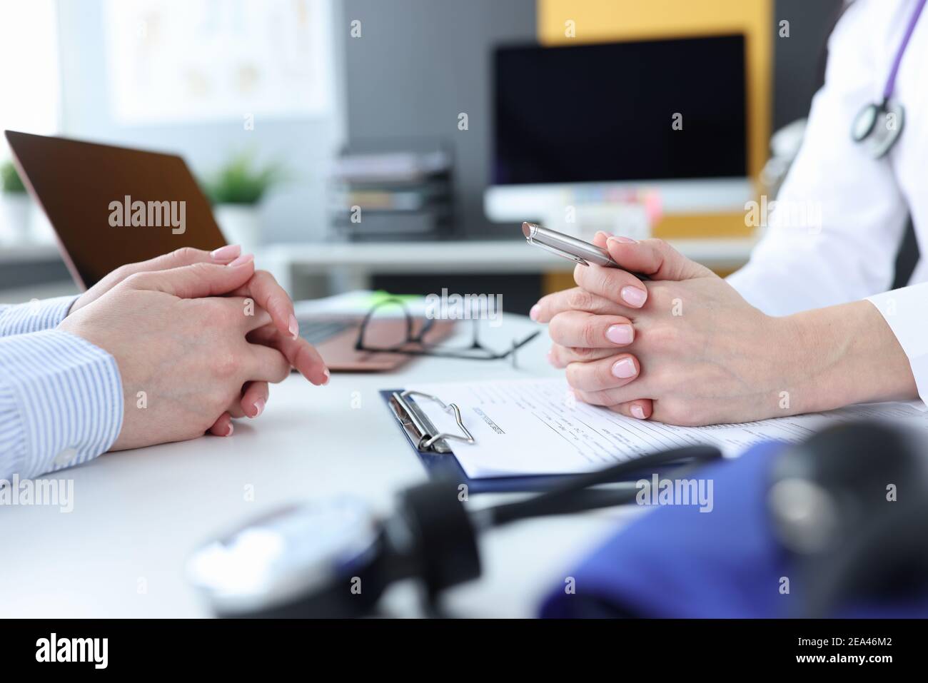 Hands of doctor and patient in medical office Stock Photo - Alamy