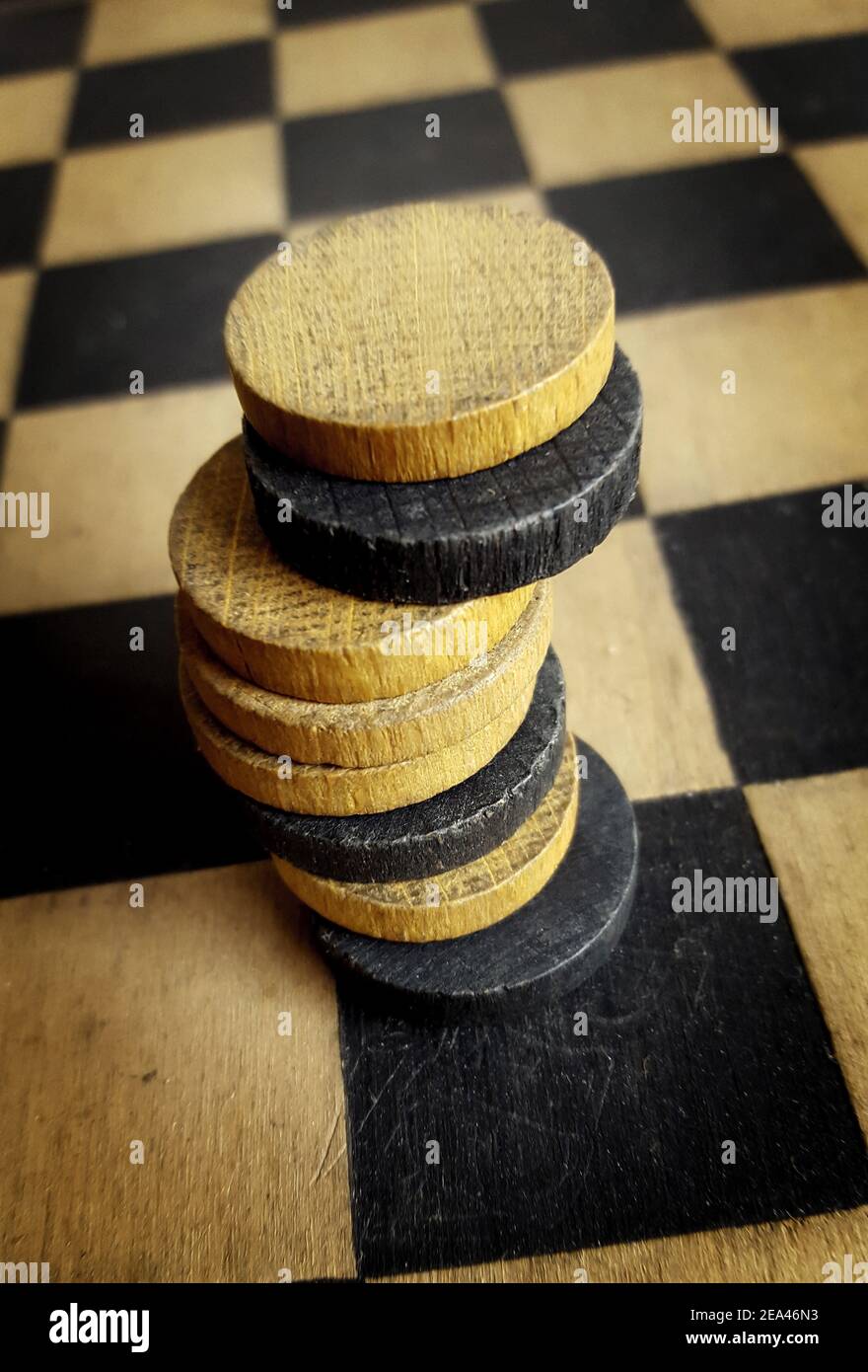 A vertical closeup of checkers on a checkerboard Stock Photo - Alamy