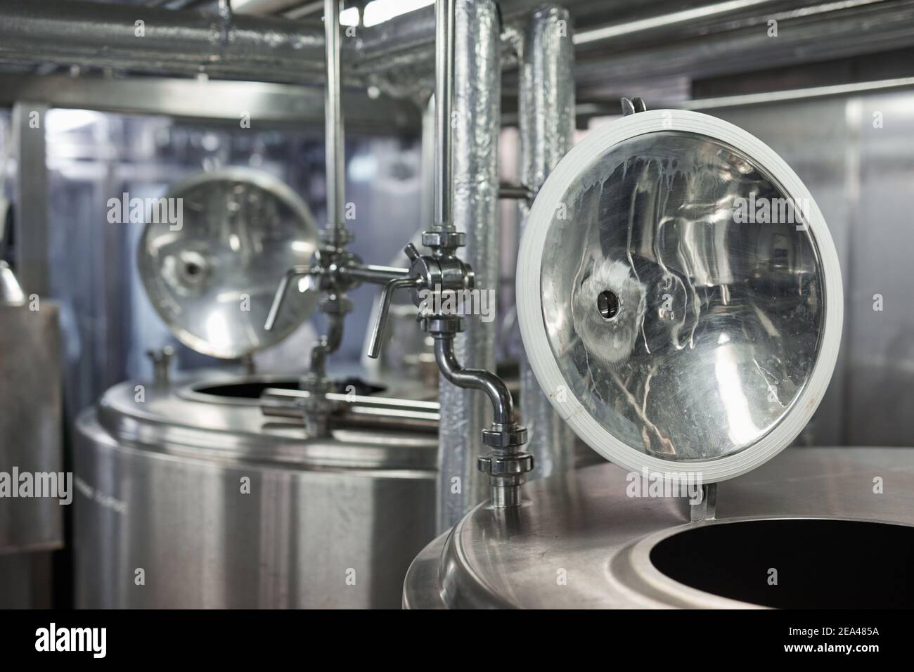 Background image of opened mixing barrels in workshop at industrial ...