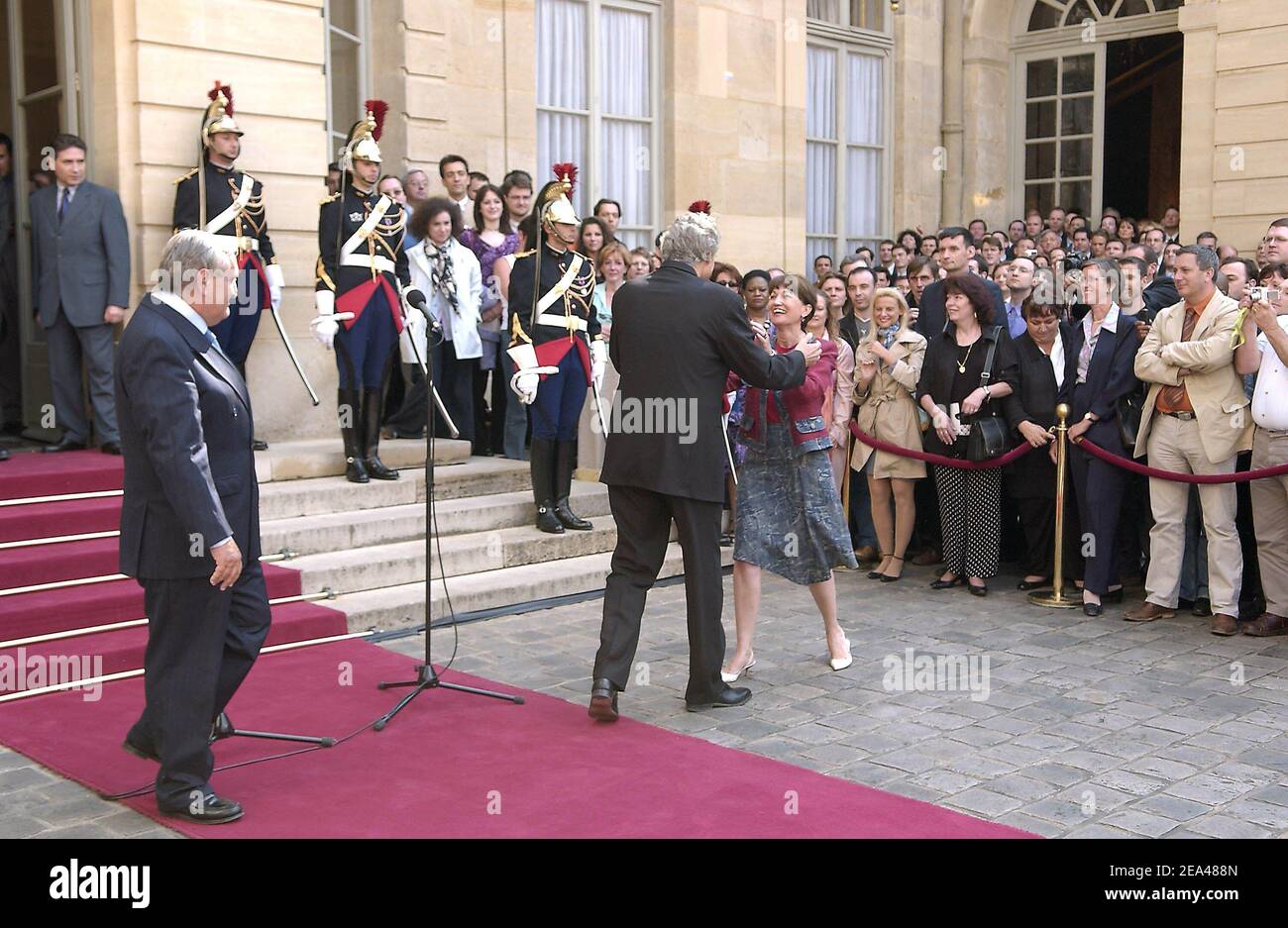 Outgoing Prime Minister Jean-Pierre Raffarin looks on as his wife Anne ...