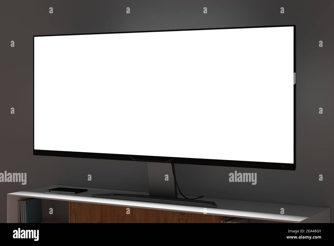 Glowing TV wide screen at night on the TV stand in living room with ...