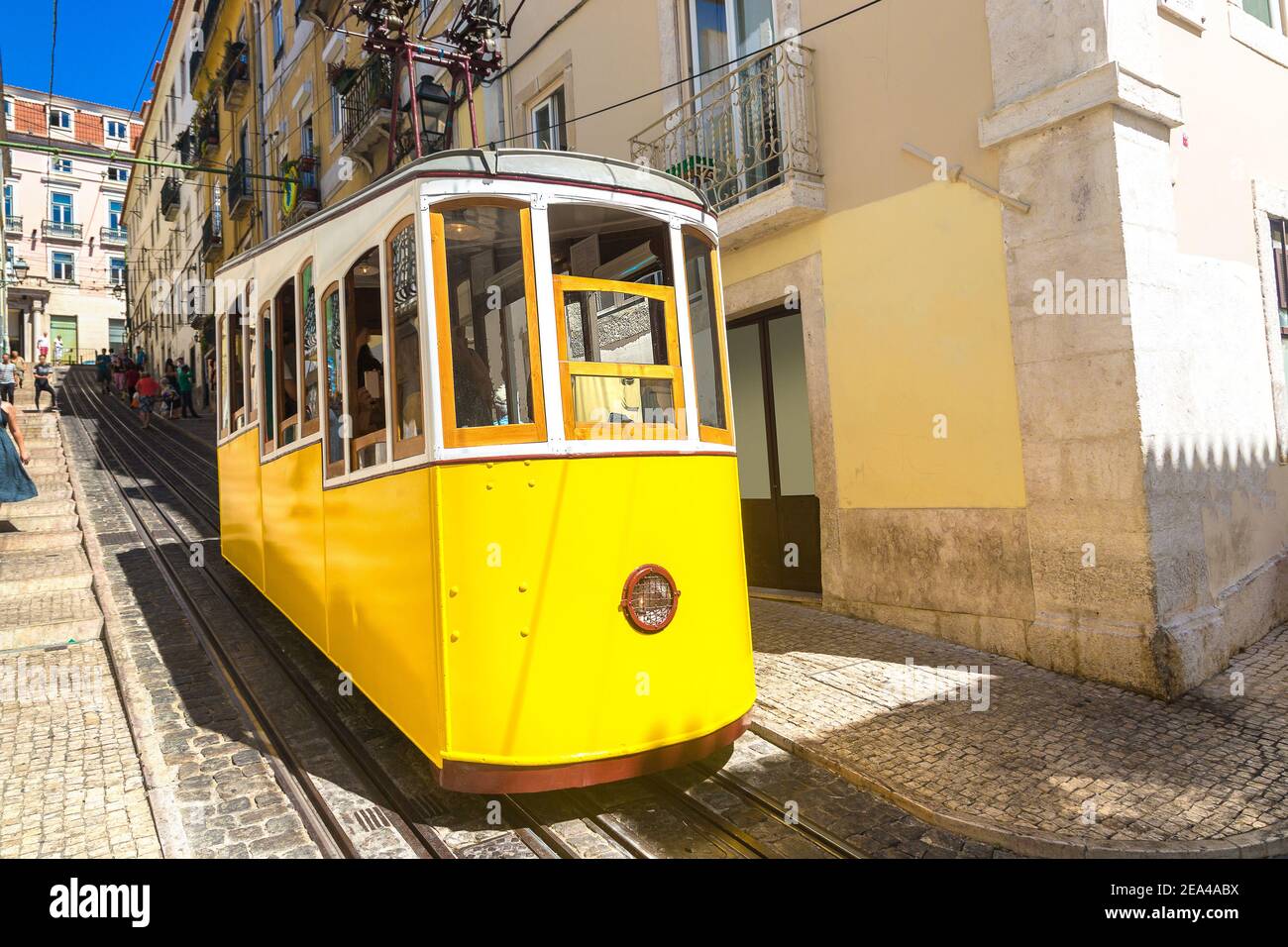 The Gloria Funicular in the city center of Lisbon in a beautiful summer ...