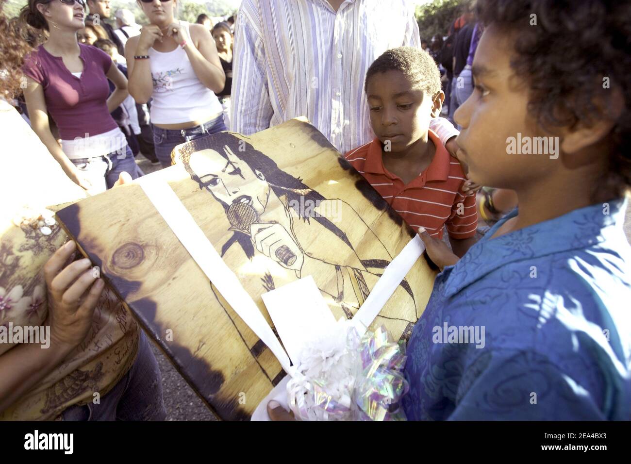 Jason Bryson (10) of Santa Maria CA holds a present for Michael Jackson ...