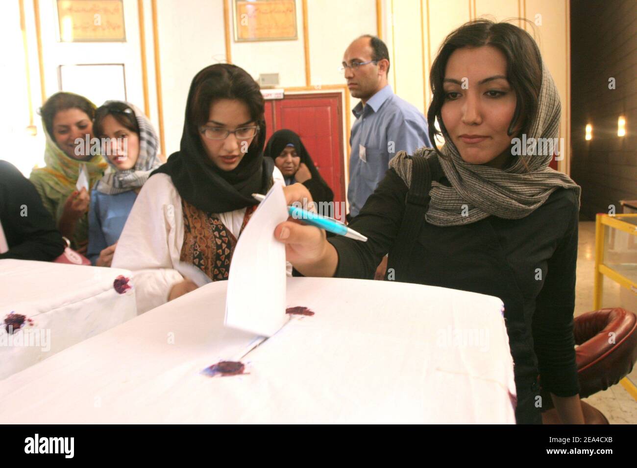 Iranian women cast their ballots in the Iranian presidential election ...