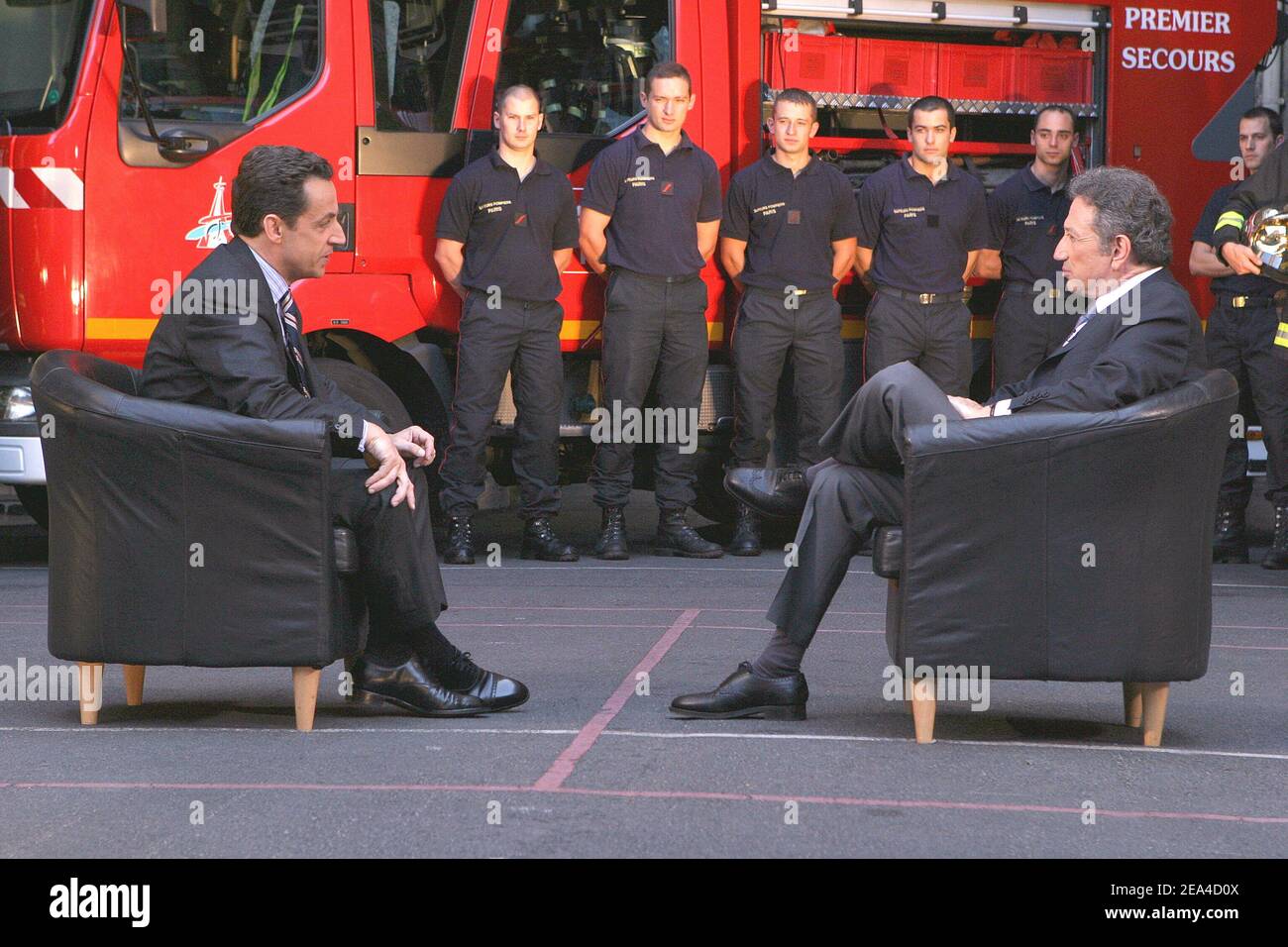 EXCLUSIVE. French Interior Minister Nicolas Sarkozy (L) and TV ...