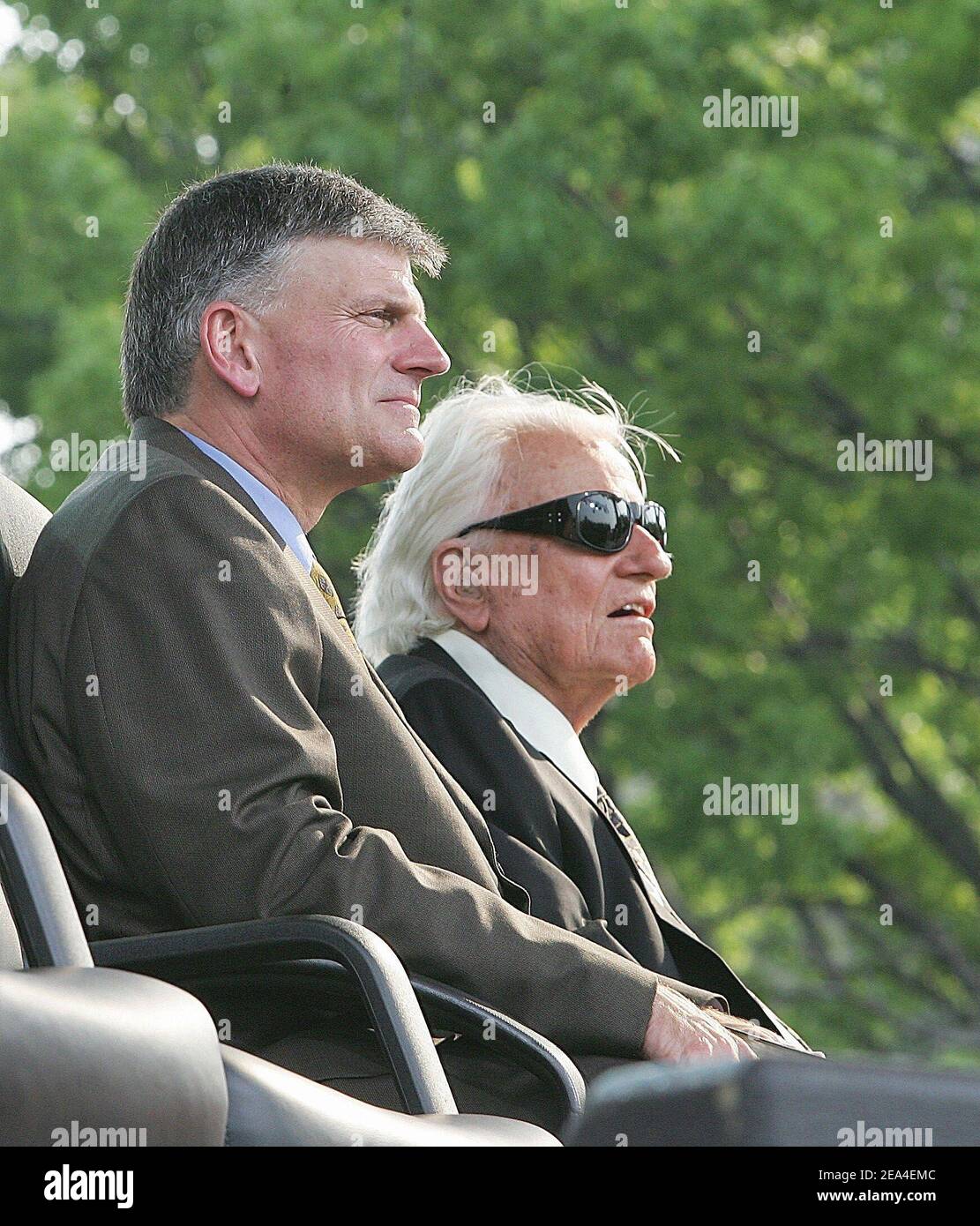 Billy Graham and his son Franklin Graham on stage during the final day ...
