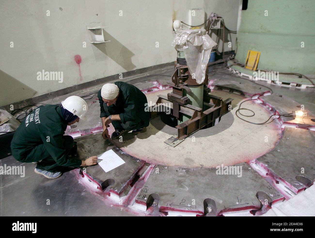 Russian engineers work on a plan inside the reactor building of the ...