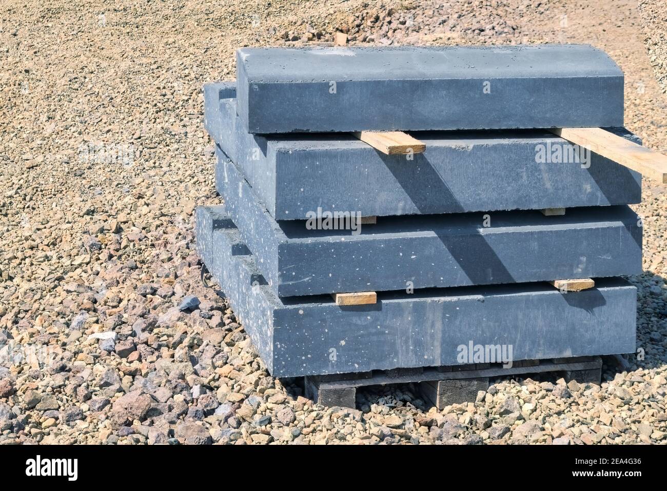 Pallet with concrete curbs for sidewalk construction. Concrete blocks ...