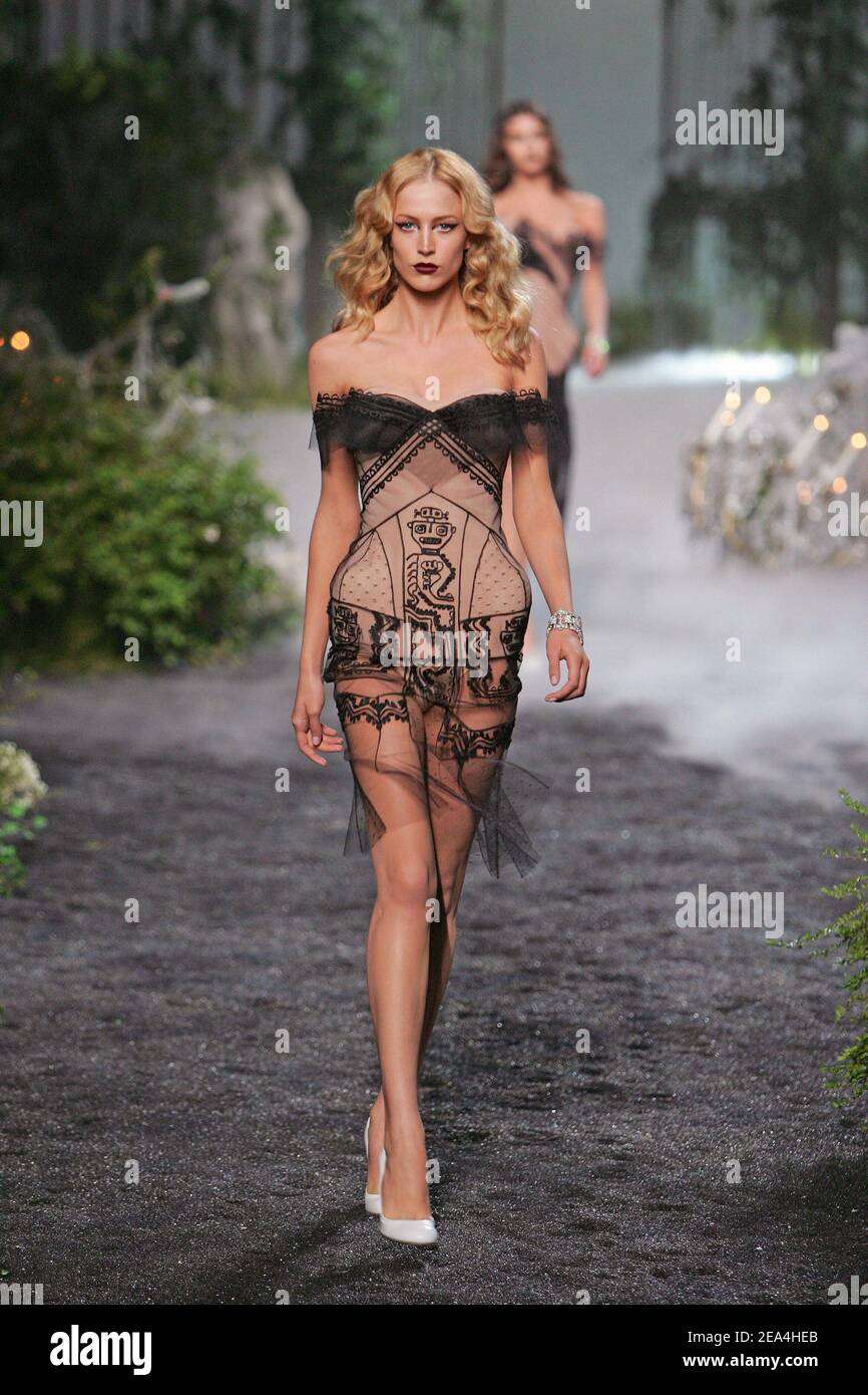 A model displays a creation by British fashion designer John Galliano for French fashion house ...