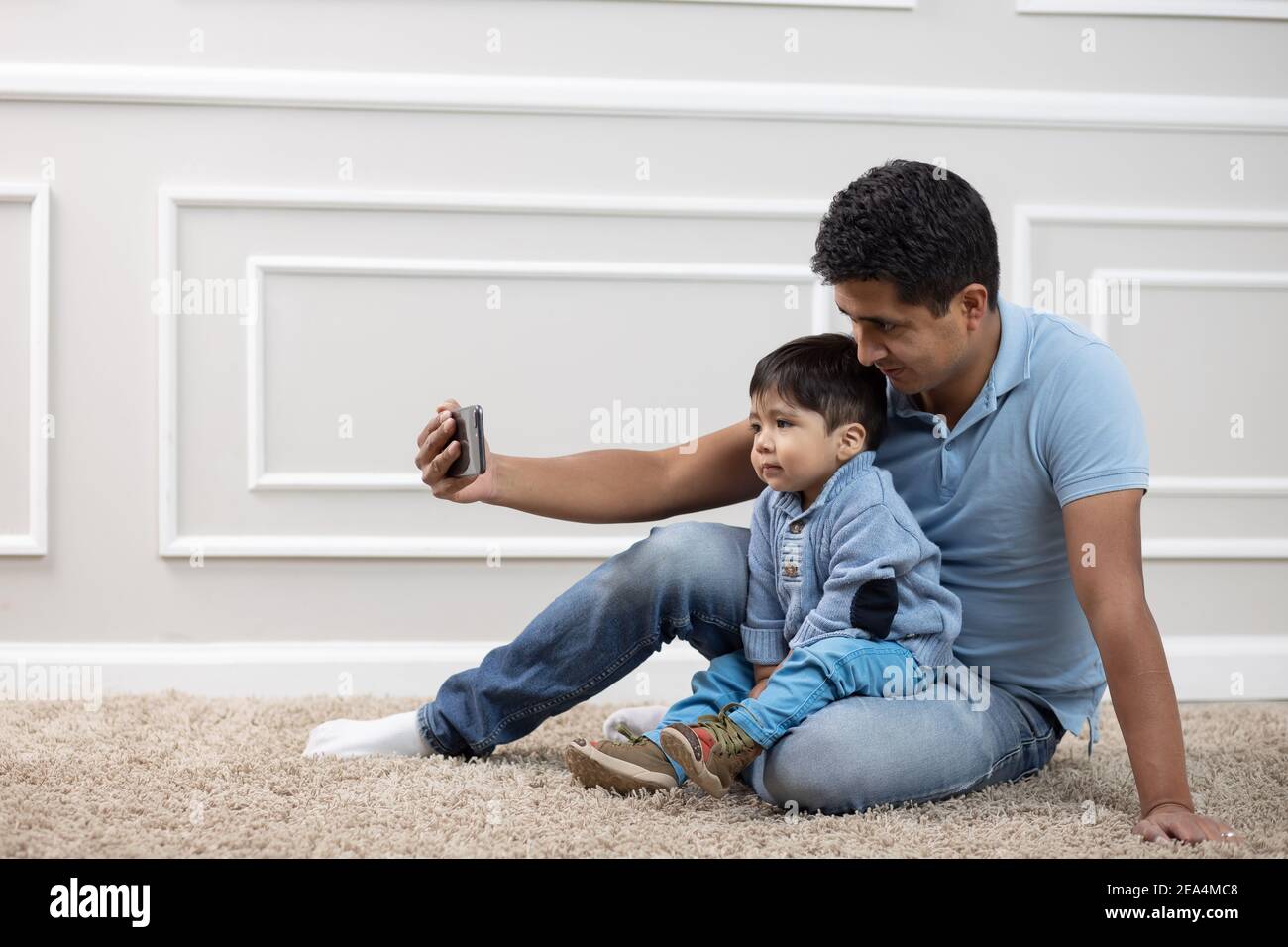 Mexican father with phone hi-res stock photography and images - Alamy