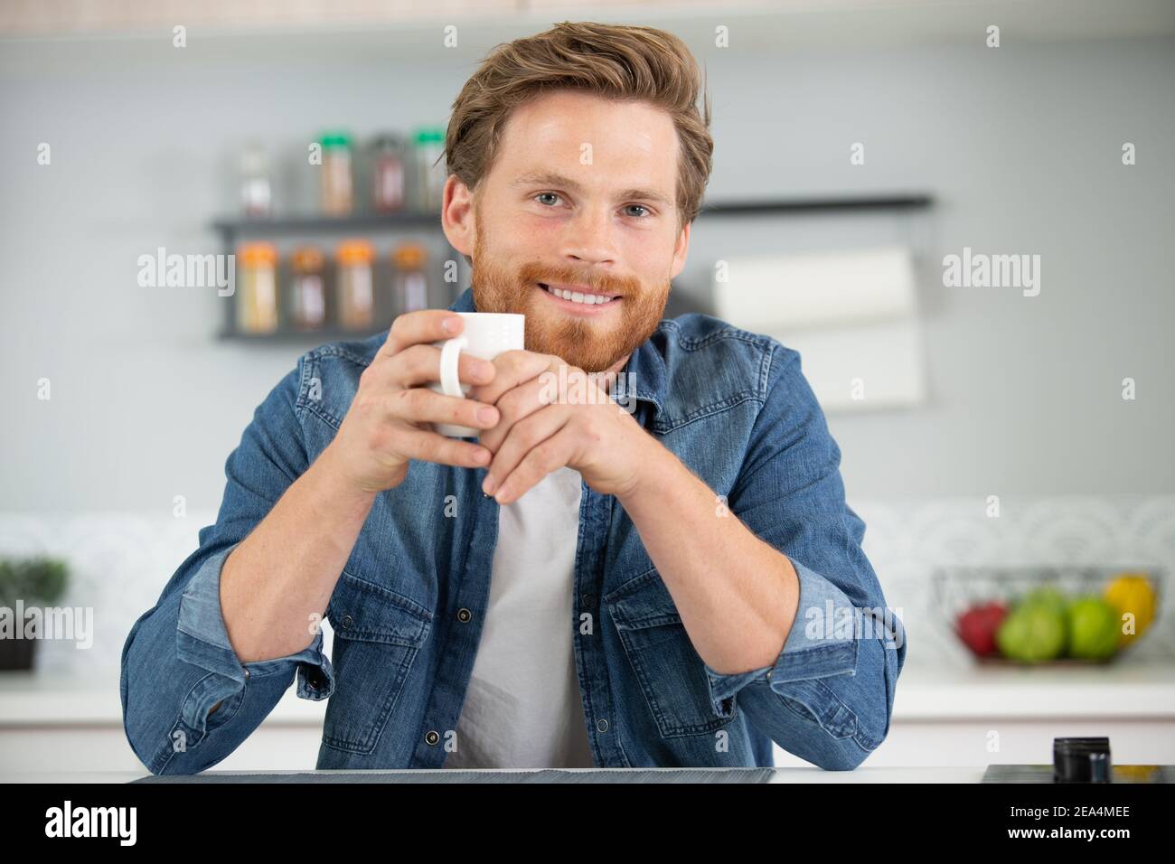 handsome man drinking coffee at home Stock Photo - Alamy