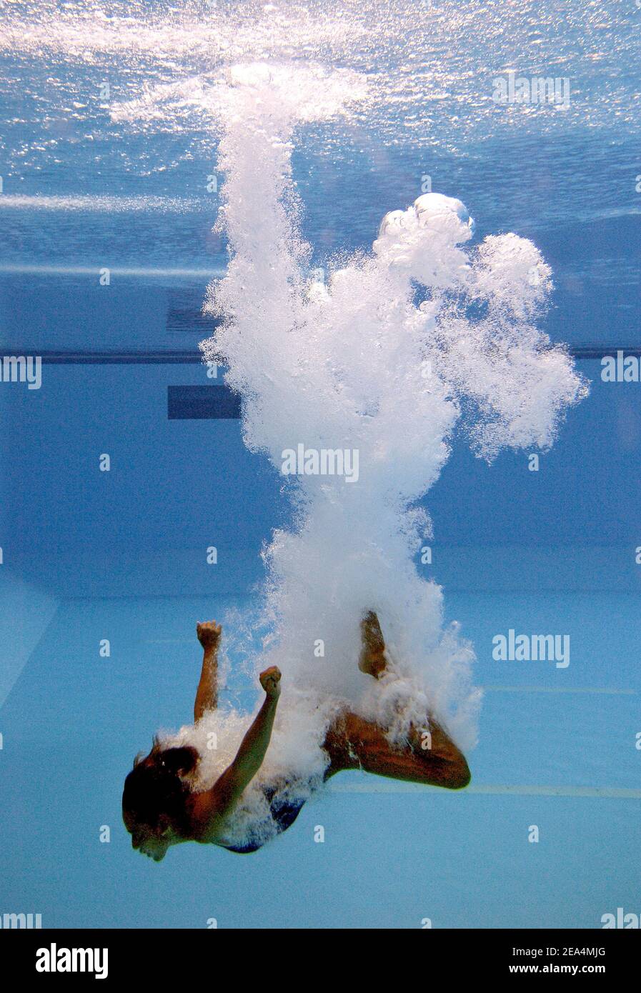 An unidentified female diver competes on women's 3 m springboard semi ...