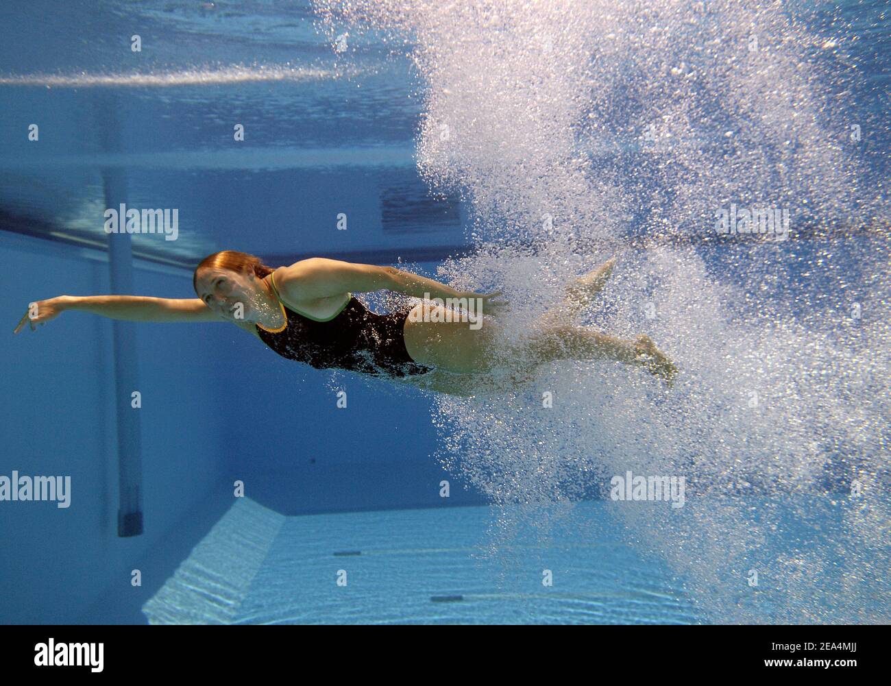An unidentified female diver competes on women's 3 m springboard semi ...