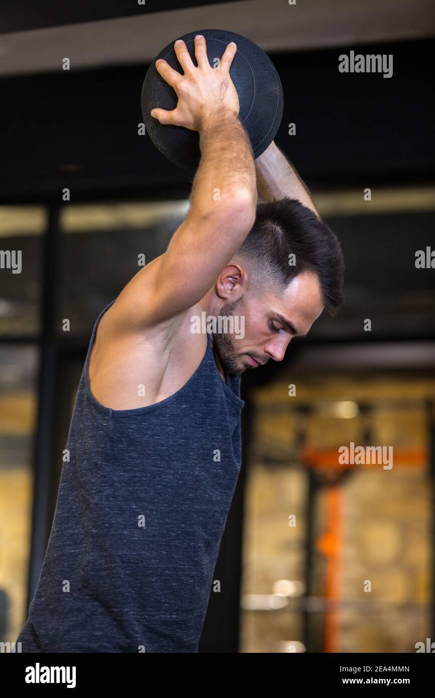 fit man throwing medicine ball Stock Photo - Alamy