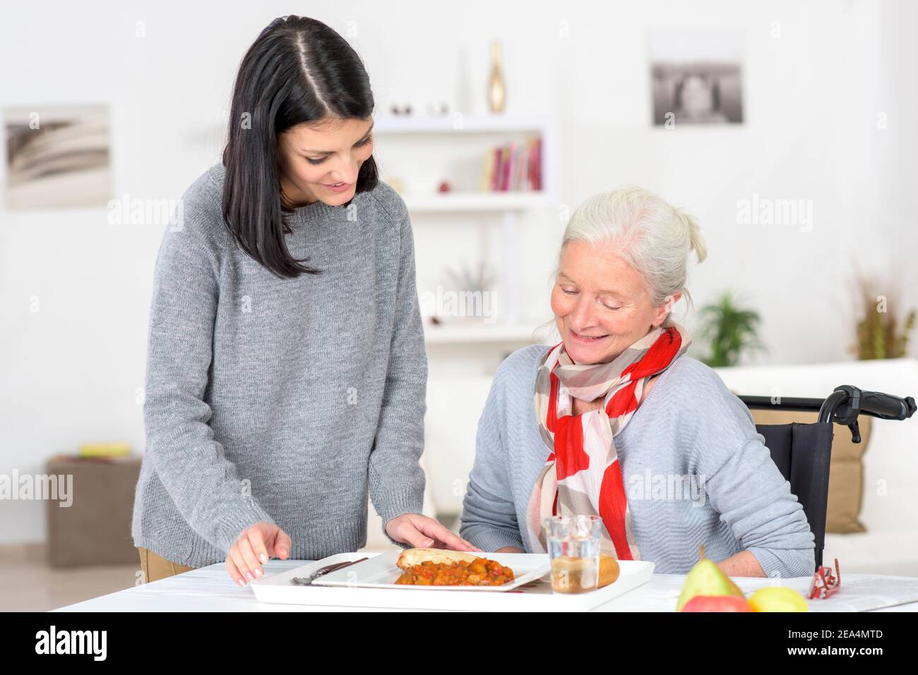 woman is serving the meal Stock Photo - Alamy