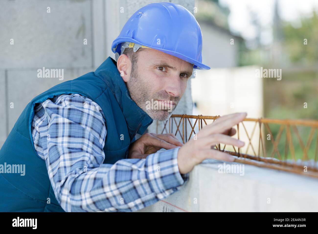 construction worker working on house structure Stock Photo - Alamy