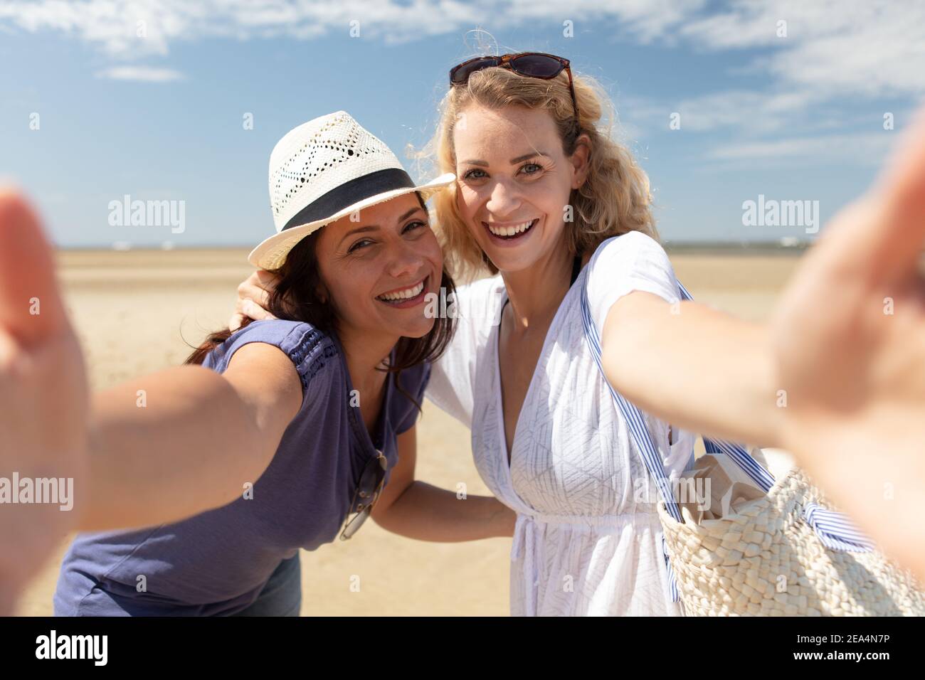 two laughing friends enjoying the beach Stock Photo - Alamy