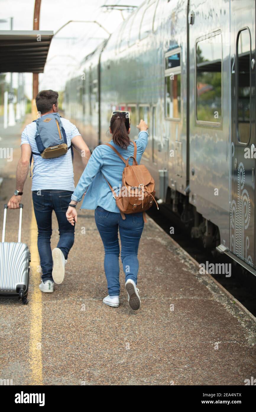 couple is late for the train at railway station Stock Photo - Alamy