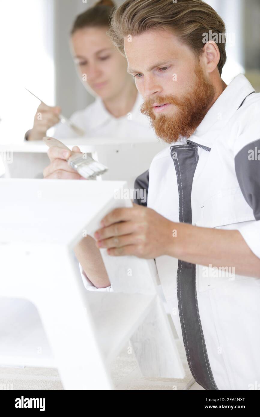 female painter and a male painter Stock Photo - Alamy