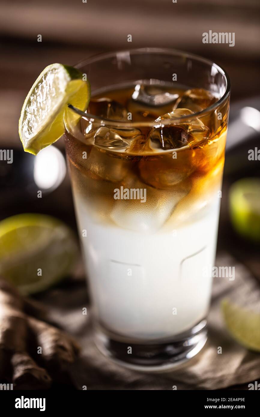 Dark n Stormy highball cocktail served as a long drink with rum, fresh lime juice, and ginger ...