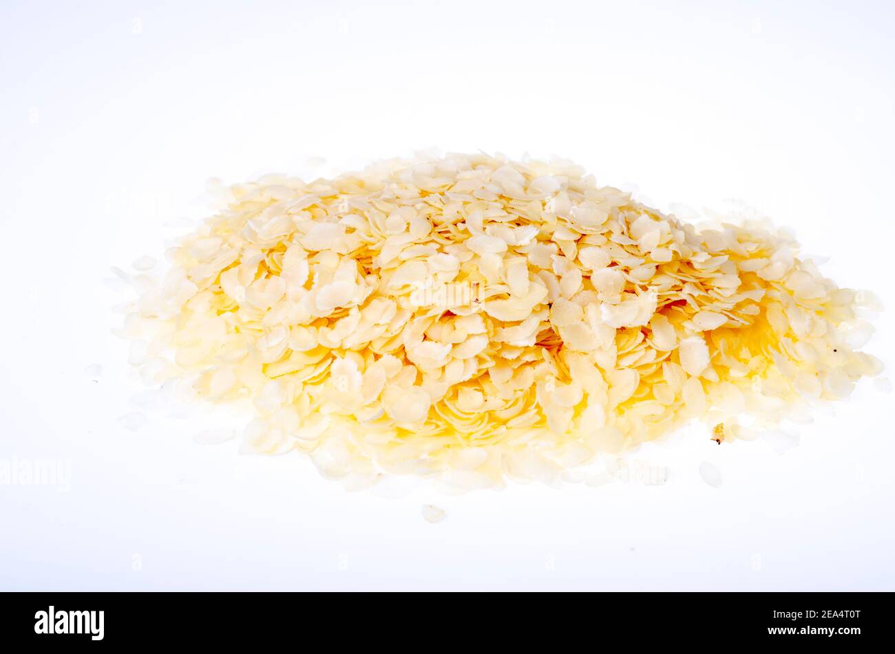 Raw flattened rice flakes isolated on white. Studio Photo Stock Photo ...