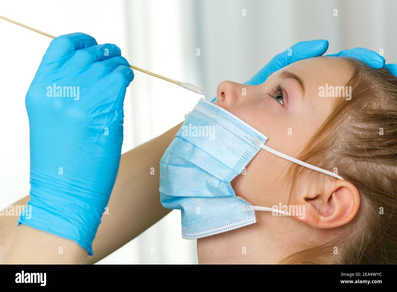 Pediatrician or doctor taking nasal mucus test, covid - 19 test . covid ...