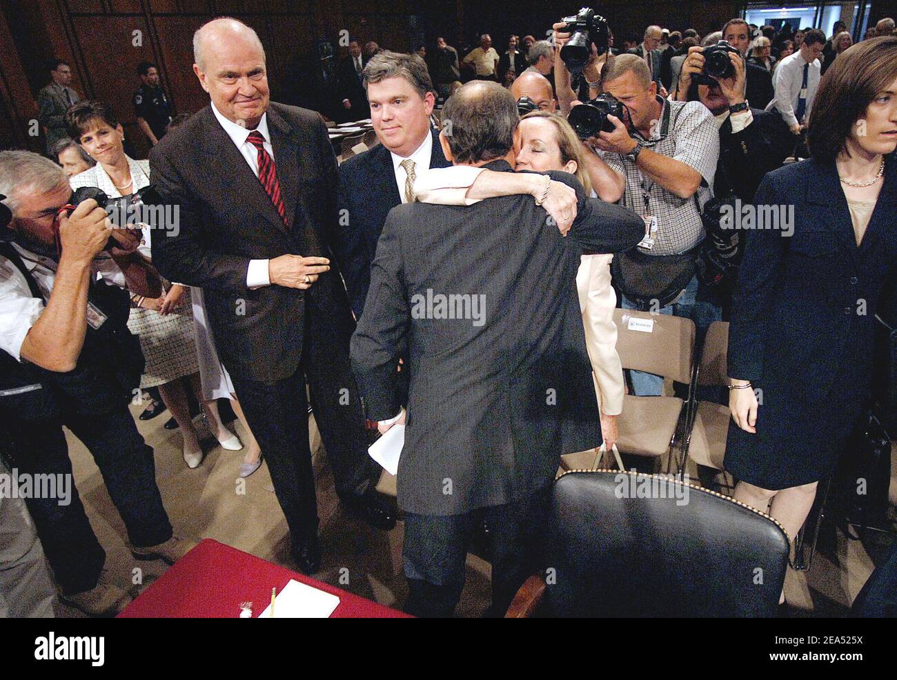 Supreme Court Chief Justice Nominee John Roberts (R) gets a hug from ...