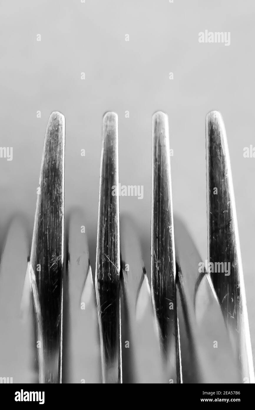 two crossed forks on a gray background. Photo Stock Photo - Alamy